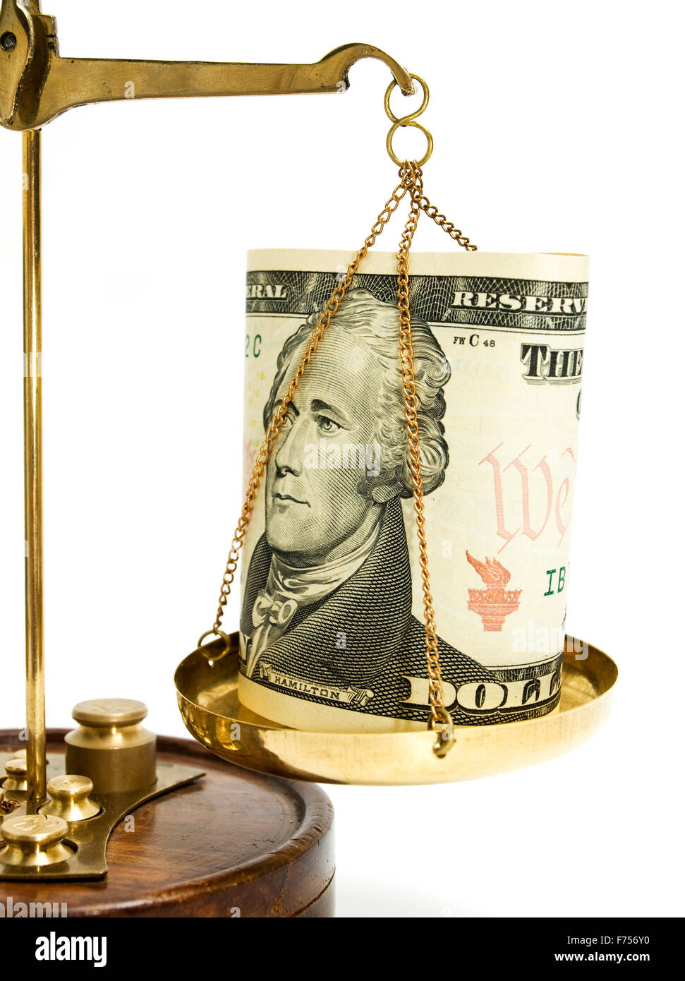 money on a balance scale Stock Photo - Alamy