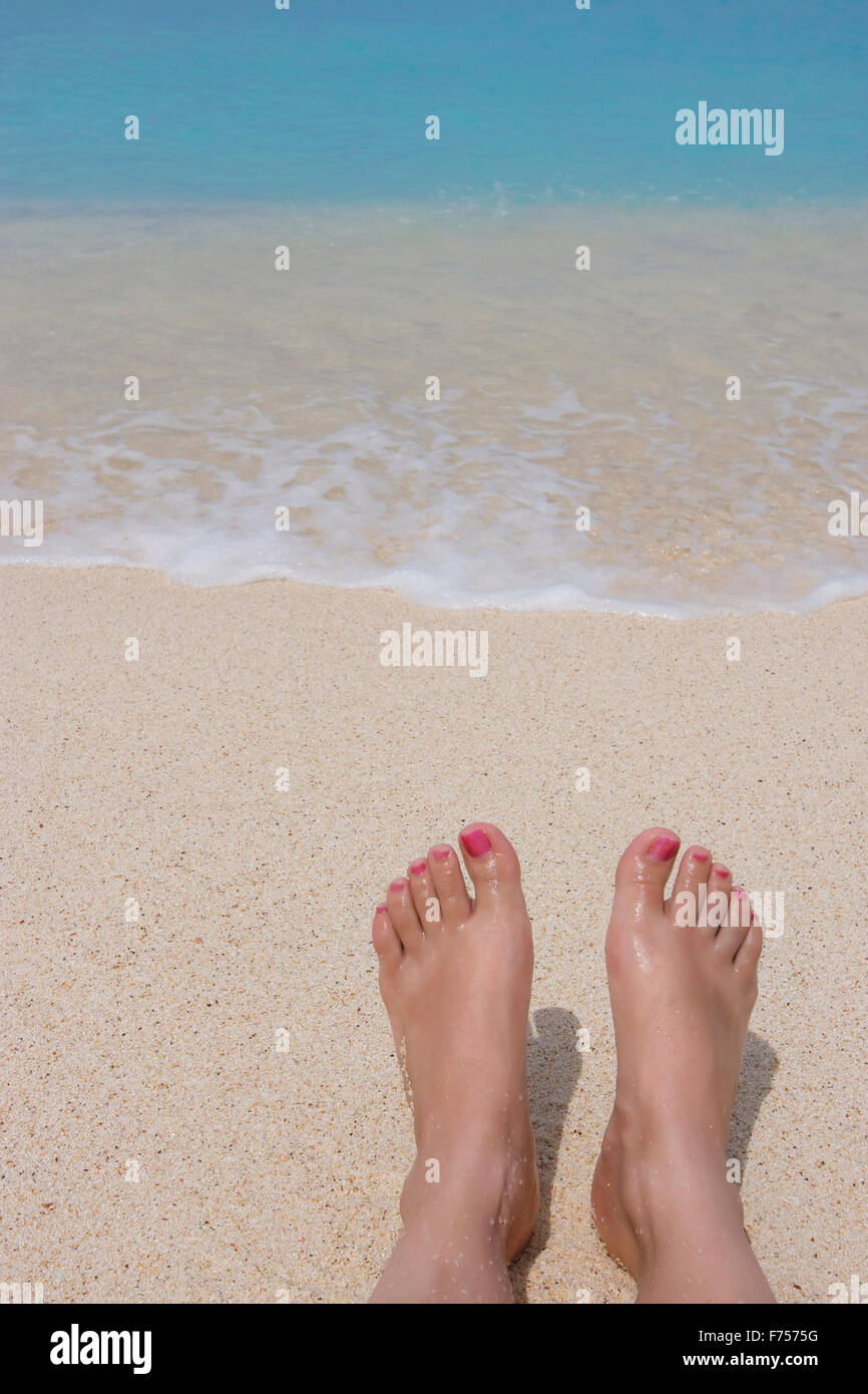 Feet at sea shore Stock Photo - Alamy