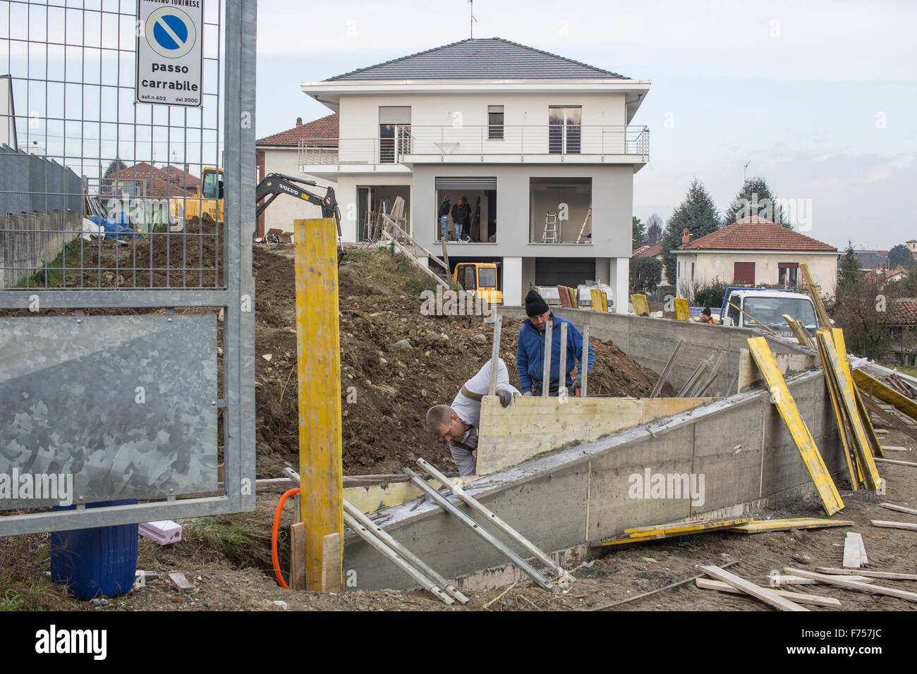 Construction workers in a house under construction in the Northern ...