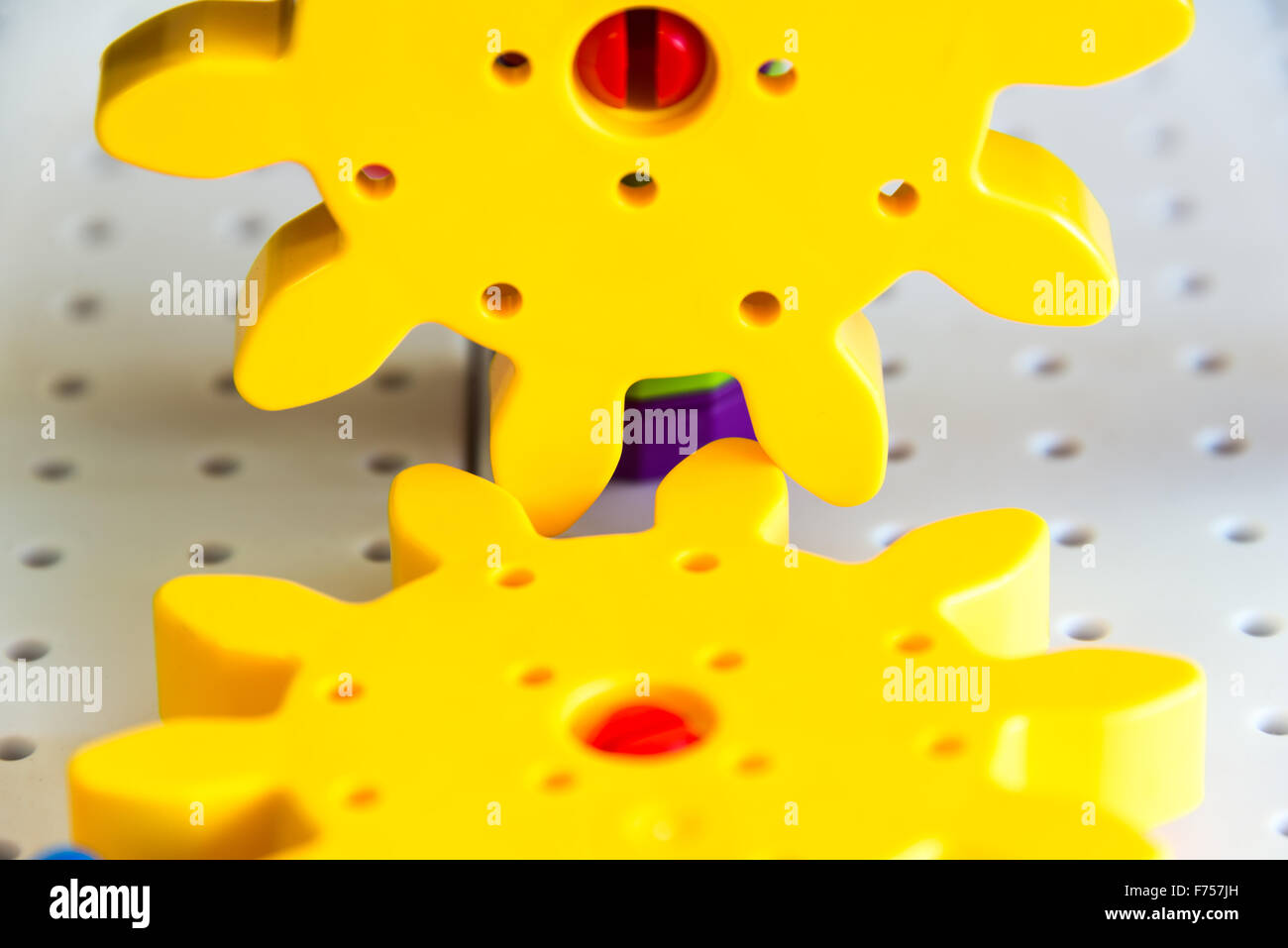 Gears from colorful children game Stock Photo - Alamy