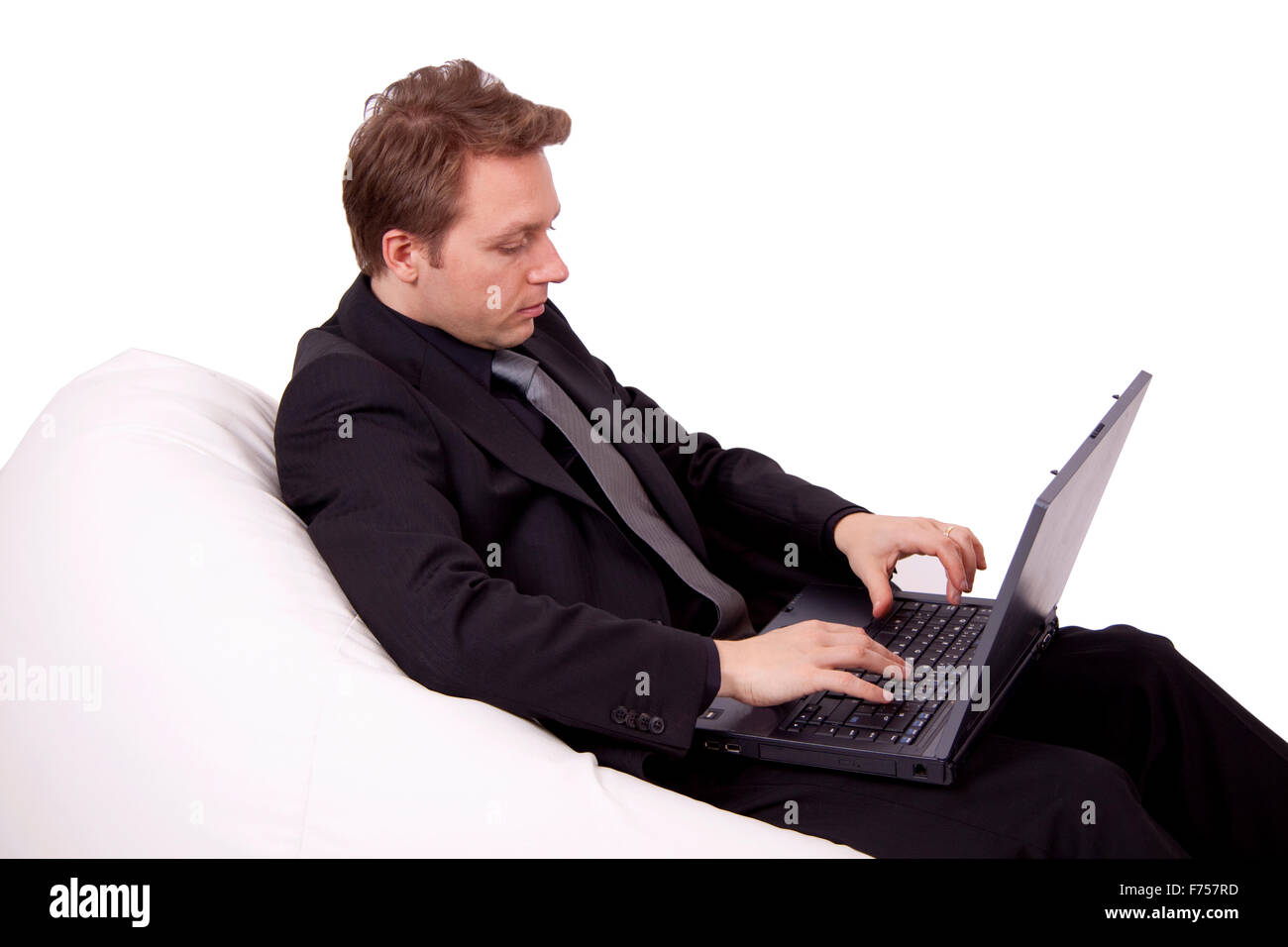 Using a laptop Stock Photo - Alamy
