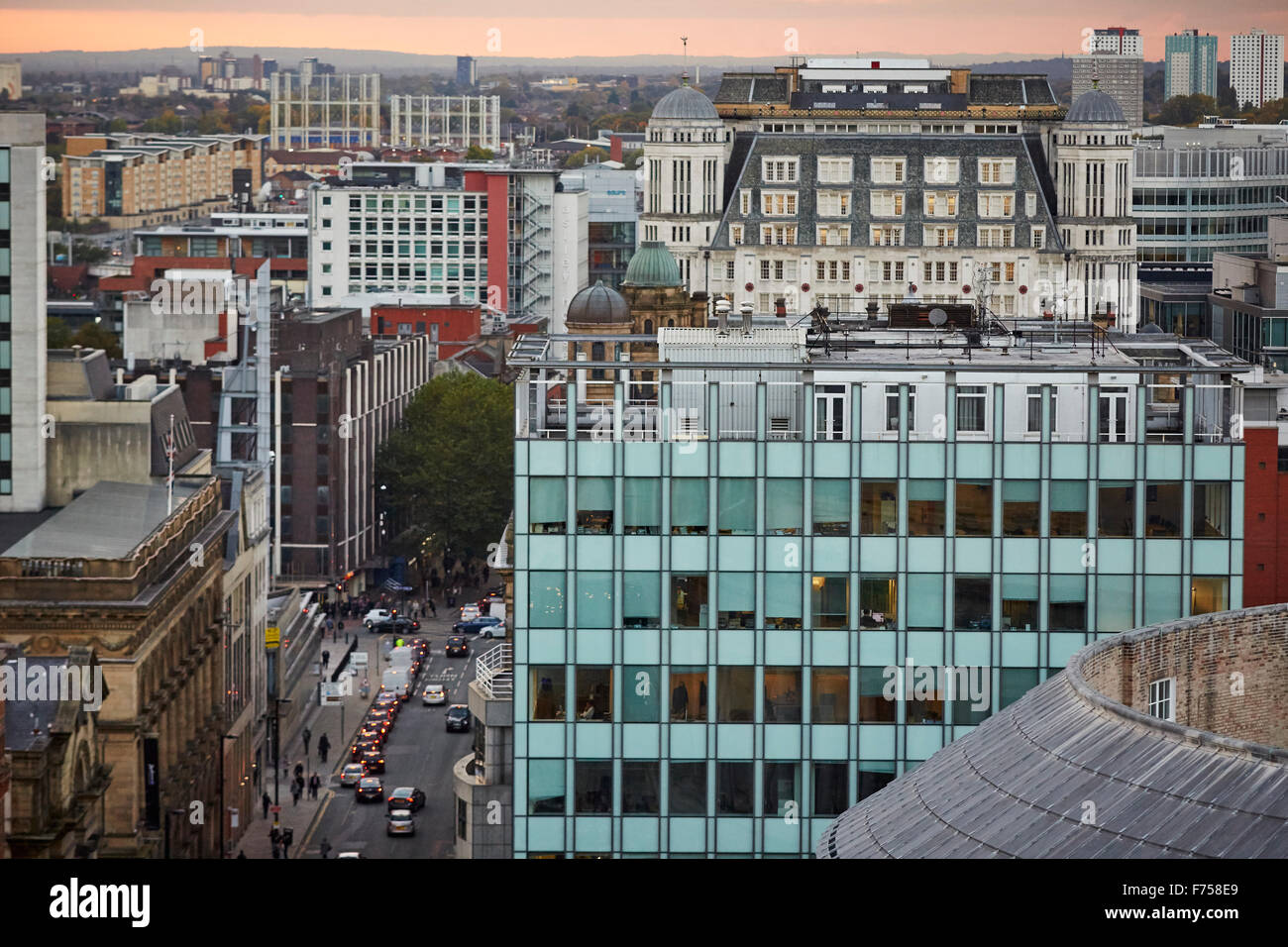Manchester skyline showing tower light shaft rays through clouds dusk ...