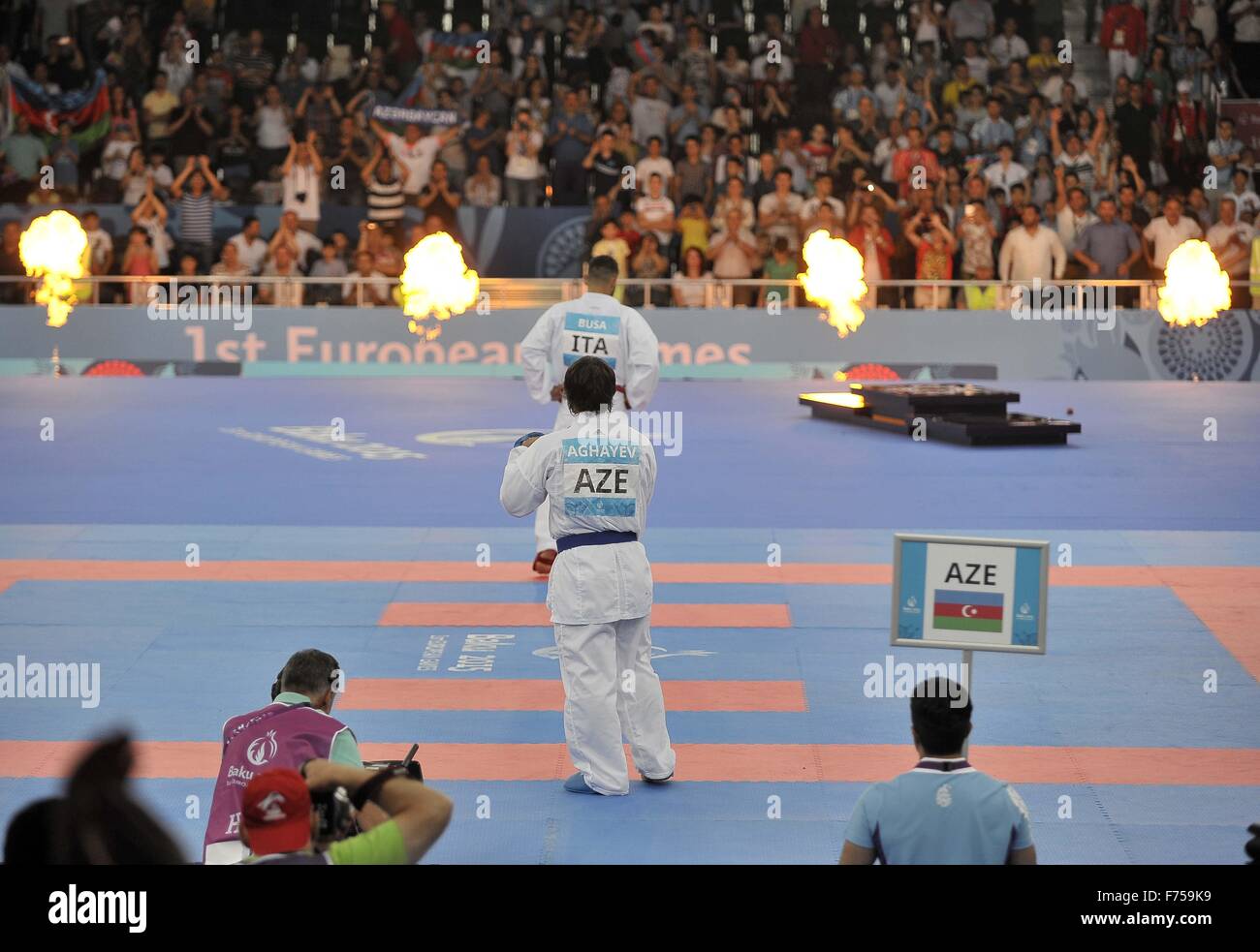 The flames go off and the crowd celebrate as Rafael Aghayev (AZE) is ...