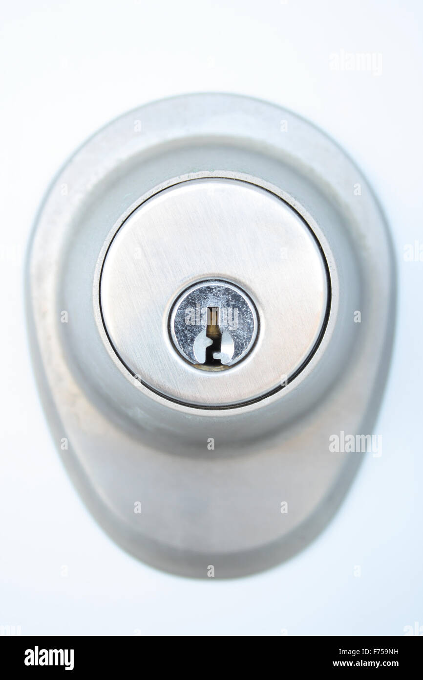 Metallic door lock with keyhole Stock Photo - Alamy