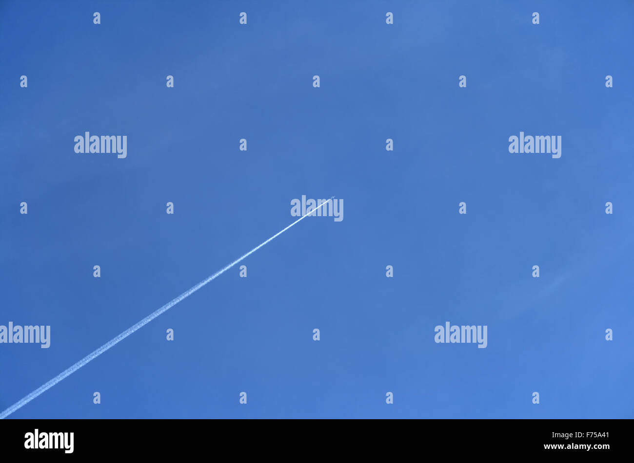 Jet airplane going up in the blue sky Stock Photo - Alamy