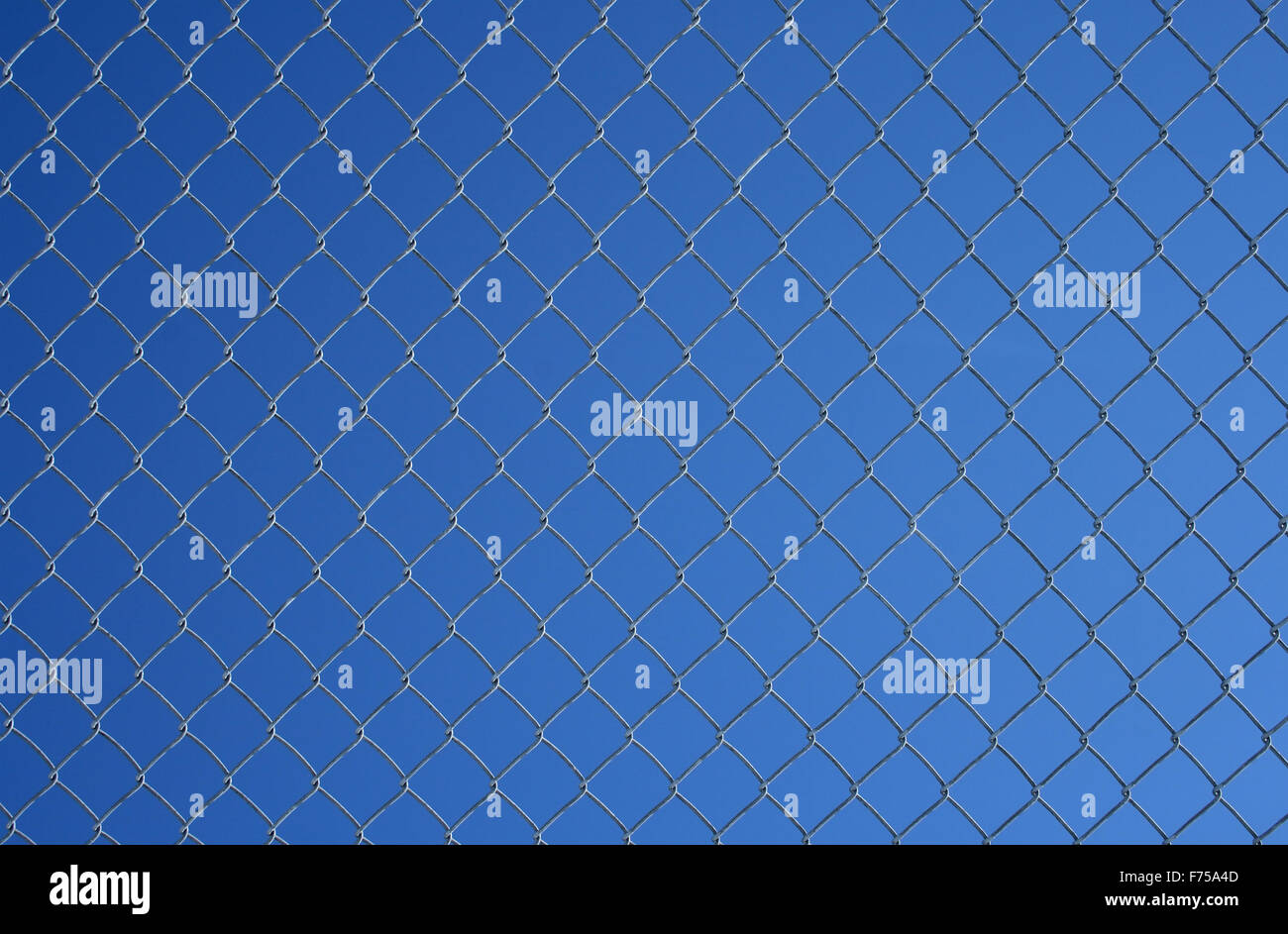 Chain link fence against the blue sky Stock Photo - Alamy
