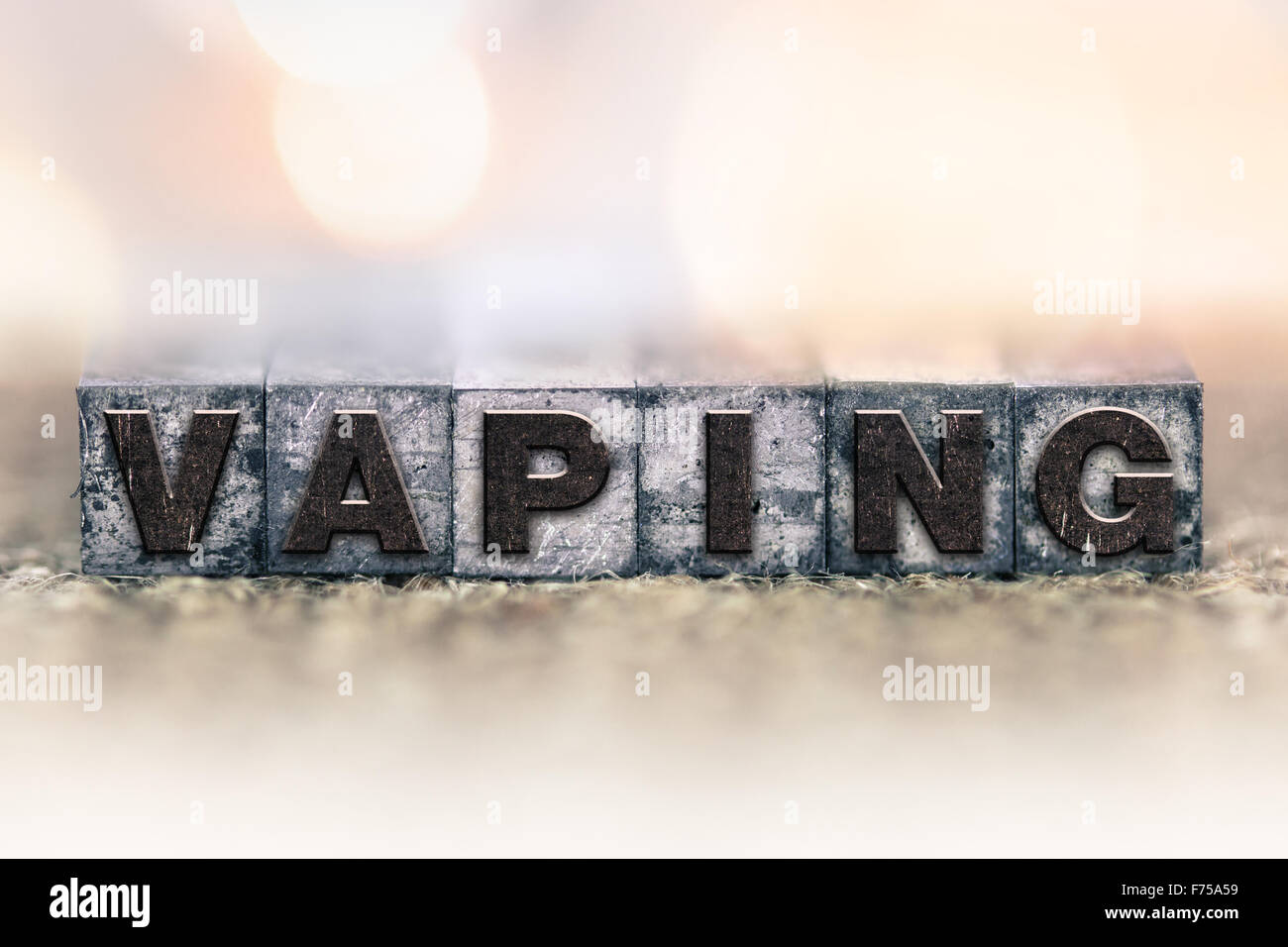 The word "VAPING" written in vintage ink stained letterpress type Stock ...