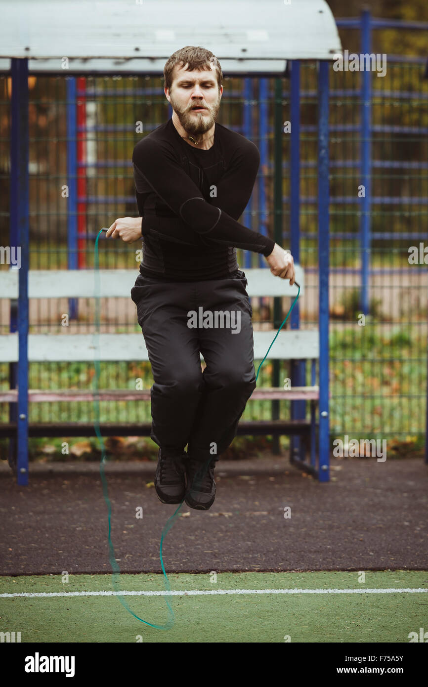 healthy athlete jumping with skipping rope outdoor Stock Photo - Alamy