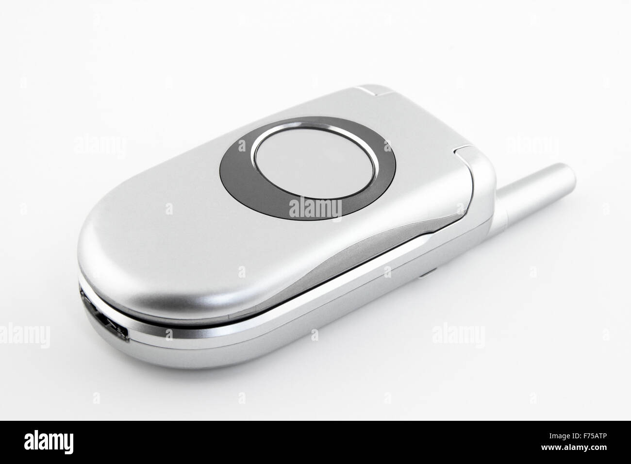 Closed silver clamshell cell phone Stock Photo - Alamy