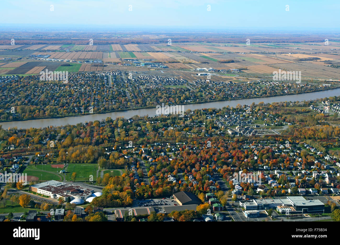 Aerial view of town near river Stock Photo - Alamy
