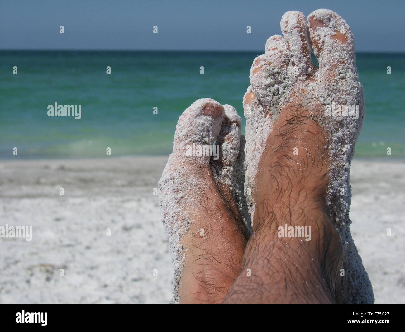 Feet in sand toes on beach relax hi-res stock photography and images ...
