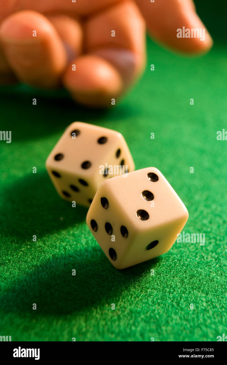 Hand rolling dice hi-res stock photography and images - Alamy