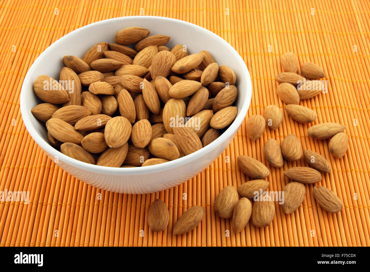 Bowl full of fresh almonds Stock Photo - Alamy