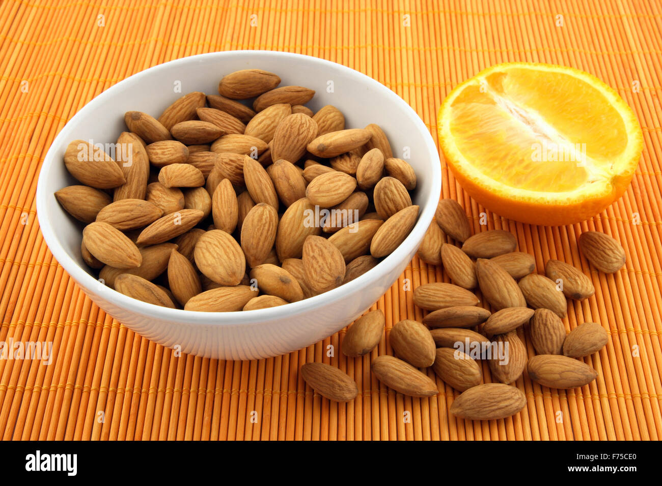 Fresh almonds and orange Stock Photo - Alamy