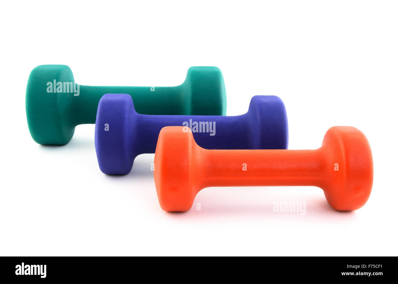 Three dumbbells of different colors Stock Photo - Alamy