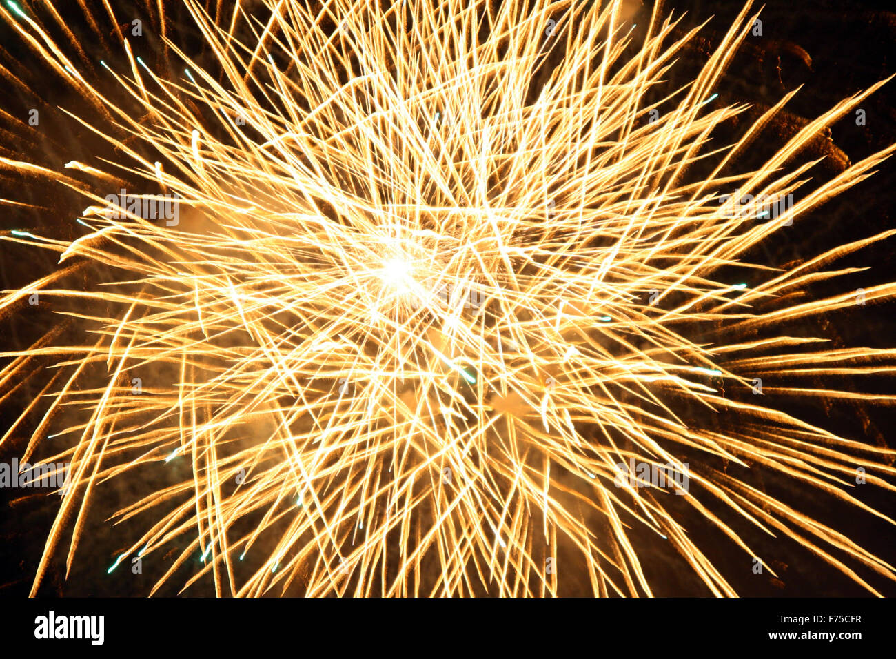 Yellow fireworks burst Stock Photo - Alamy