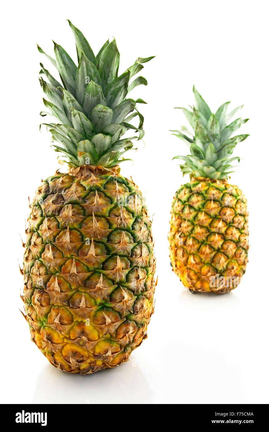 Two ripe pineapples, focus on the closest one Stock Photo - Alamy