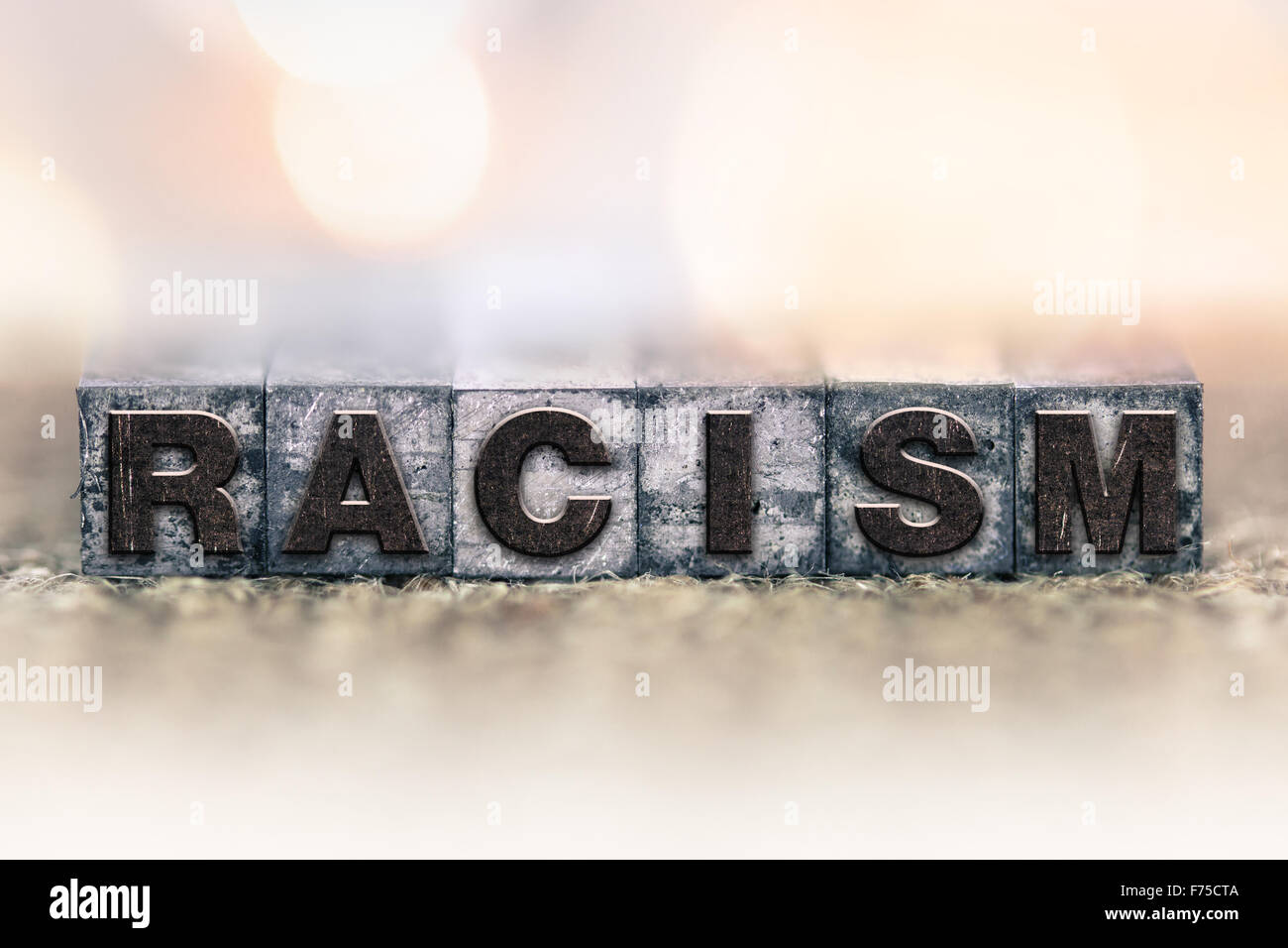 The word "RACISM" written in vintage ink stained letterpress type Stock ...