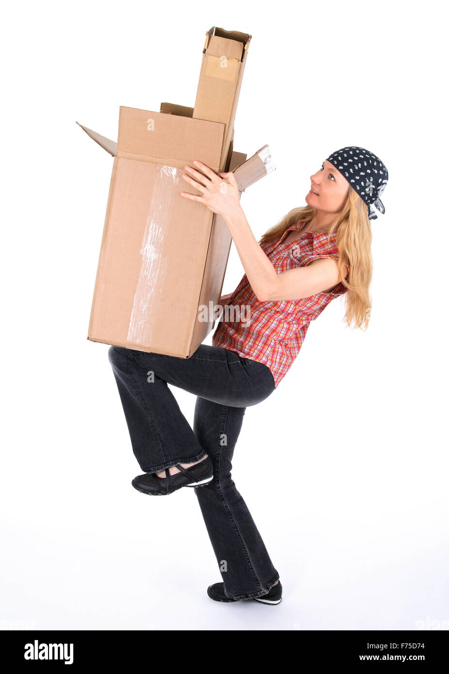 Girl balancing with cardboard boxes Stock Photo - Alamy