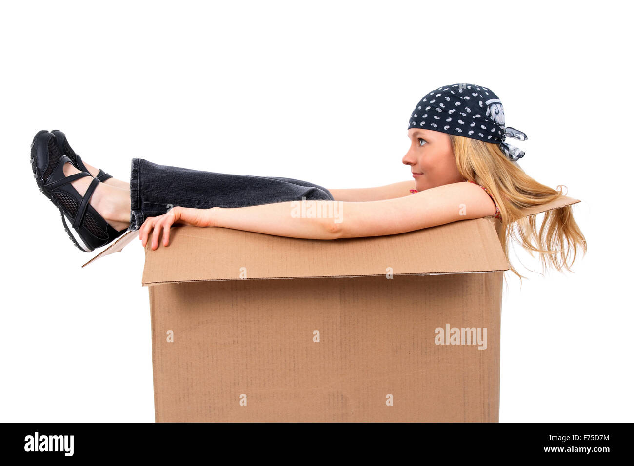 Girl sitting in a cardboard box Stock Photo - Alamy