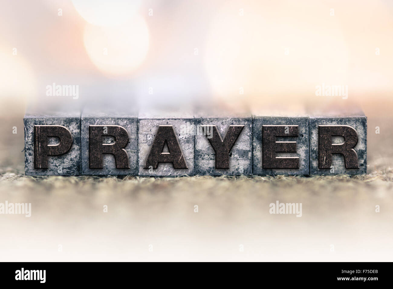 The word "PRAYER" written in vintage ink stained letterpress type Stock ...
