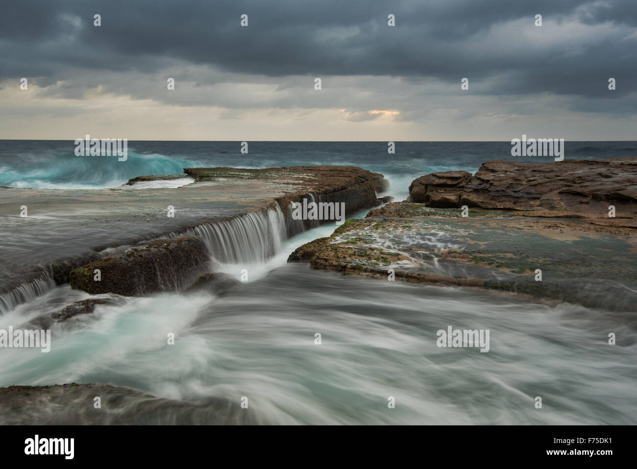 Cold stormy seascape with rushing wave and flowing water Stock Photo ...