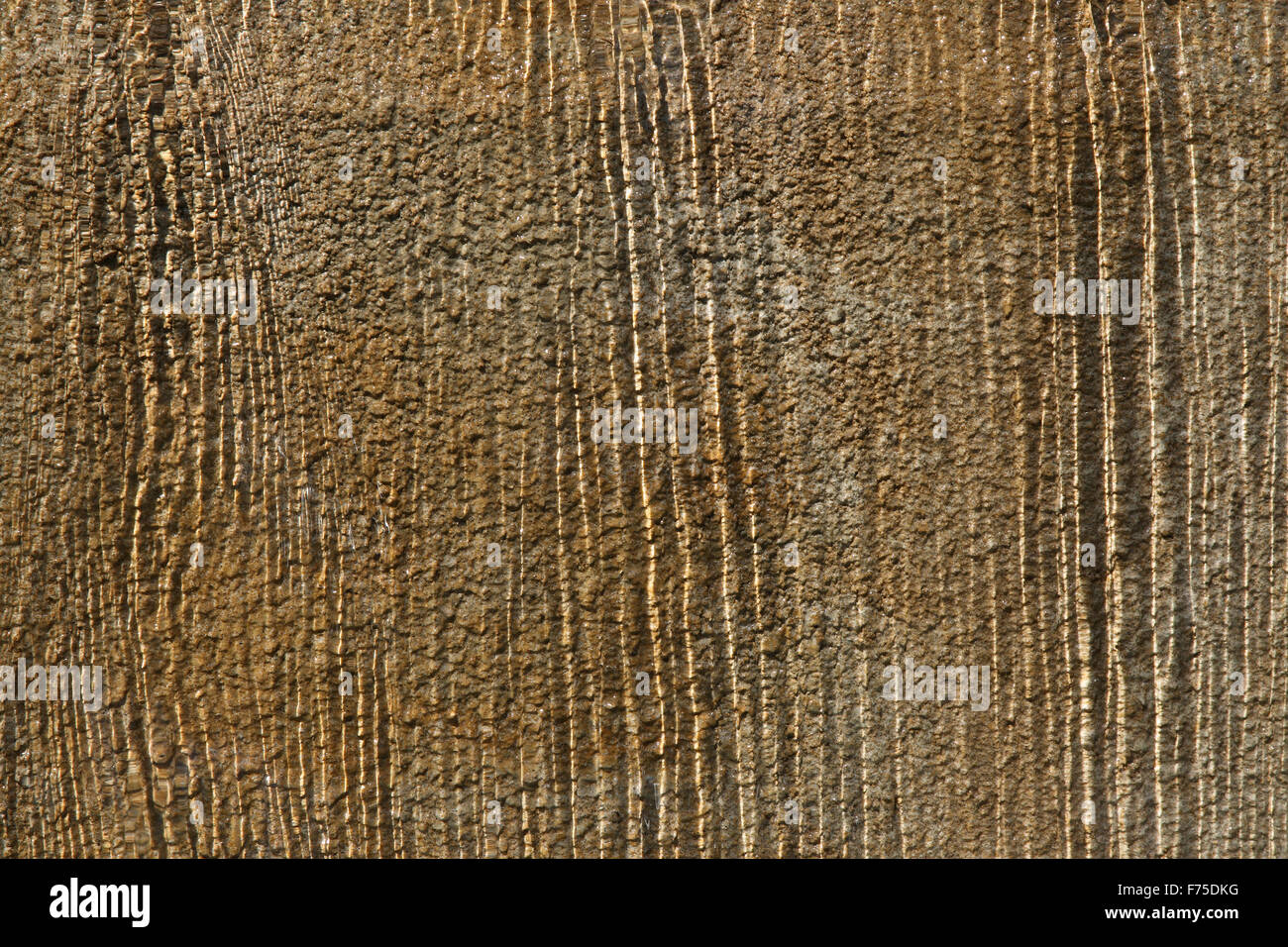 Streams of water running over stone wall Stock Photo - Alamy