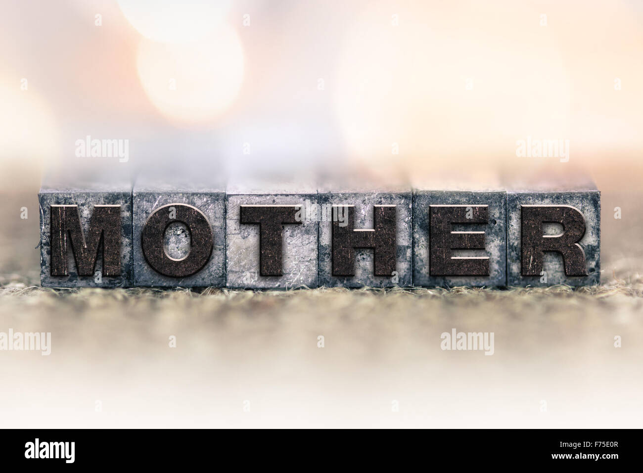 The word "MOTHER" written in vintage ink stained letterpress type Stock ...