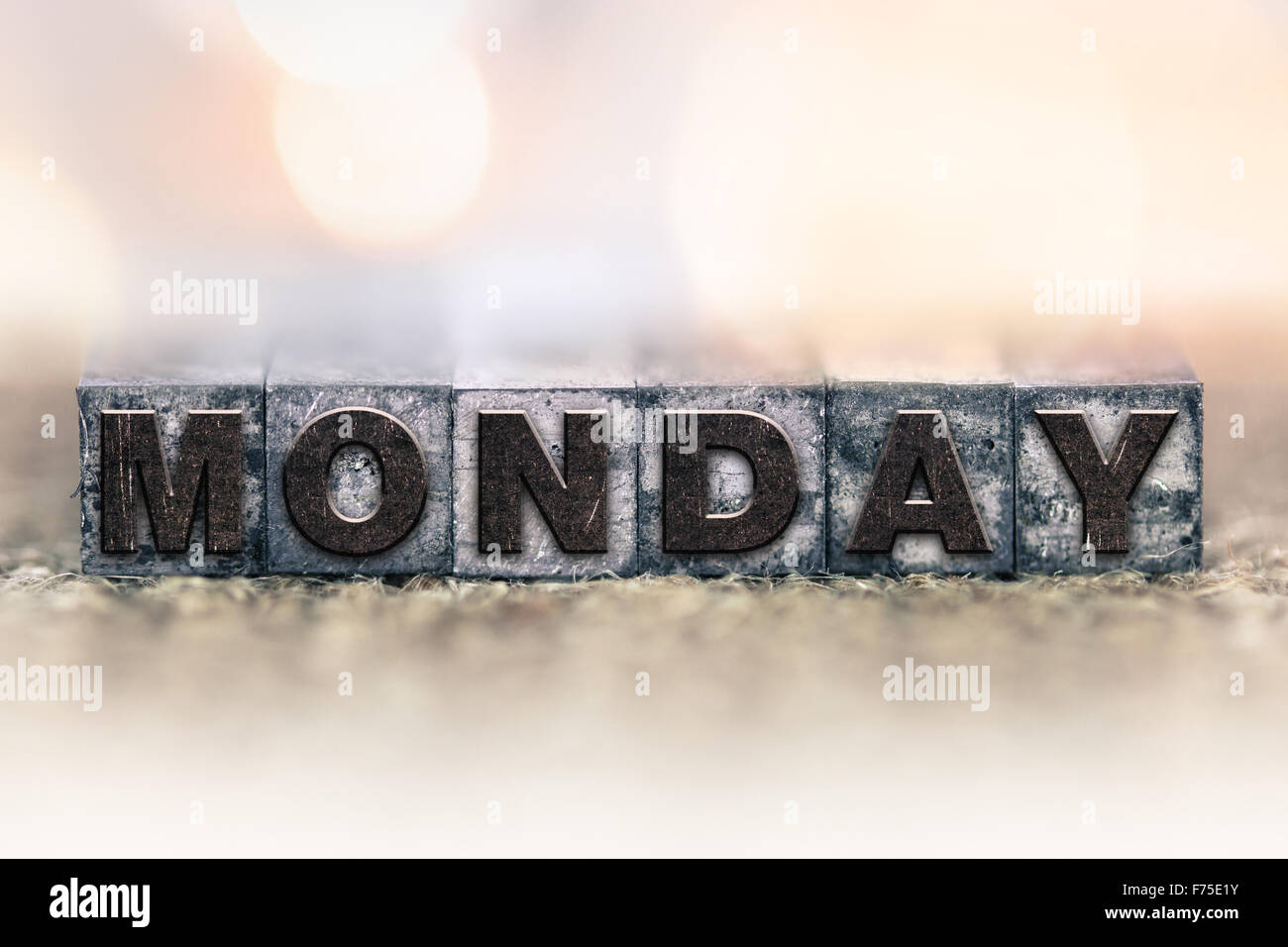 The word "MONDAY" written in vintage ink stained letterpress type Stock ...