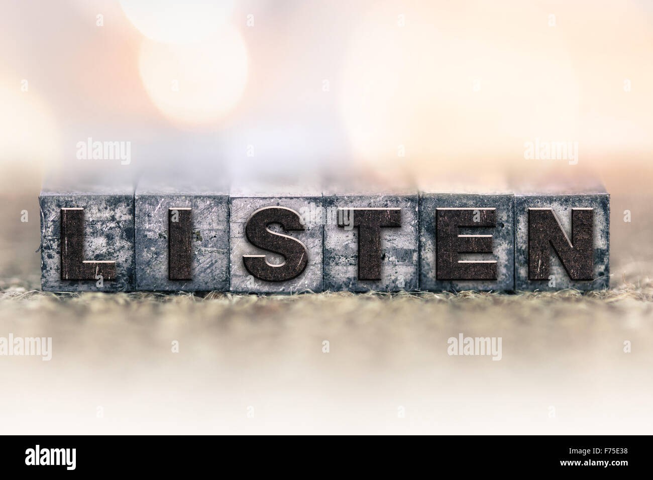 The word "LISTEN" written in vintage ink stained letterpress type Stock ...