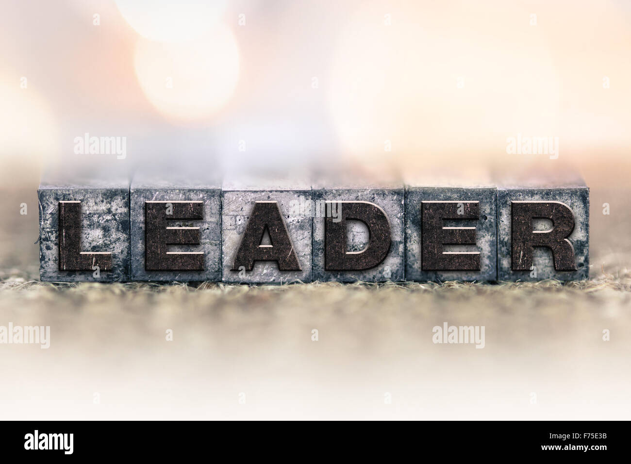 The word "LEADER" written in vintage ink stained letterpress type Stock ...