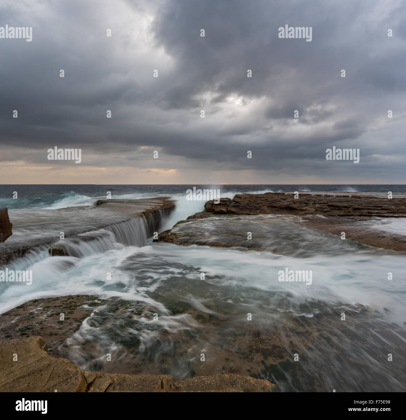 Cold stormy panoramic seascape with rushing wave and flowing water ...