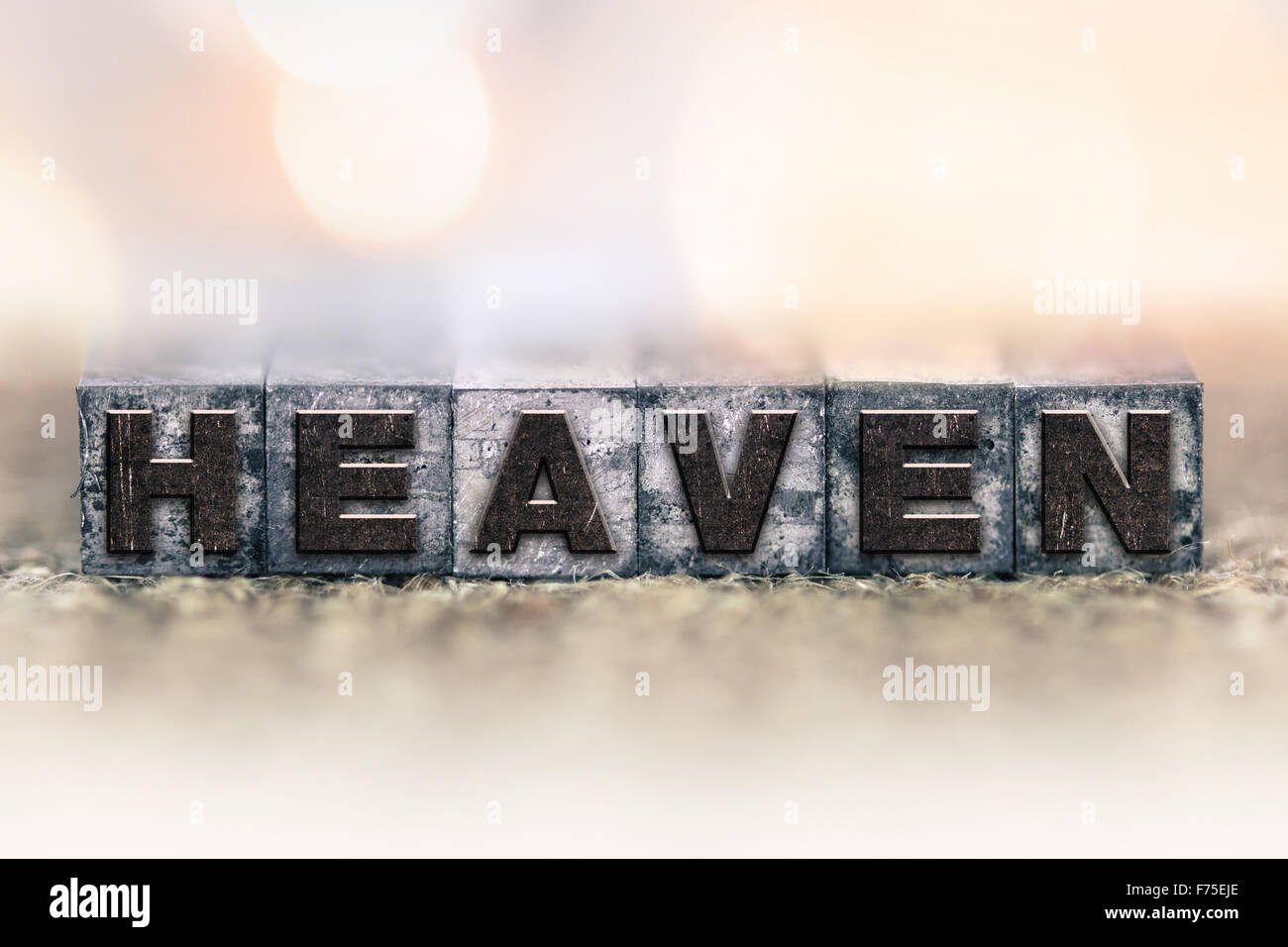 The word "HEAVEN" written in vintage ink stained letterpress type Stock ...