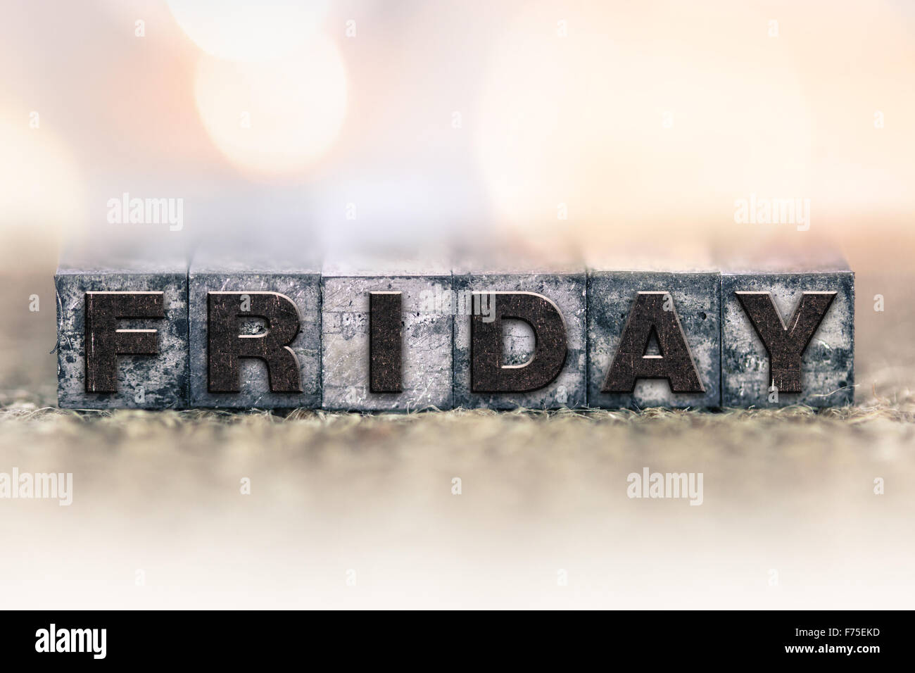 The word "FRIDAY" written in vintage ink stained letterpress type Stock ...
