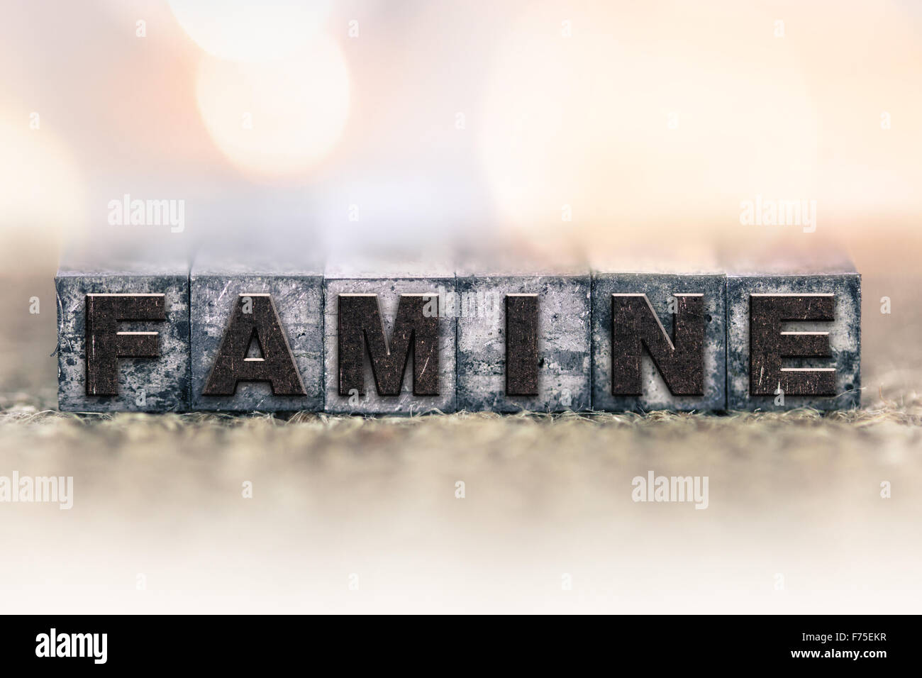 The word "FAMINE" written in vintage ink stained letterpress type Stock ...