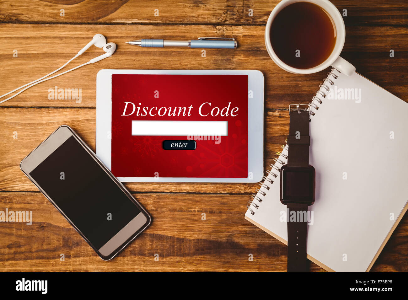 Composite image of tablet and smartphone and swatch on notepad next to ...