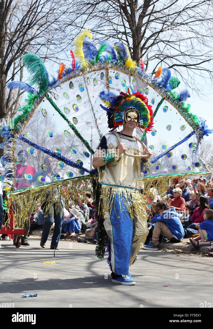 A man dressed in a costume of rainbow colors at the May Day parade in ...