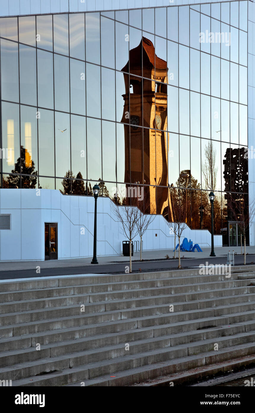 The Spokane Clock Tower reflecting at sunset in the glass windows of ...