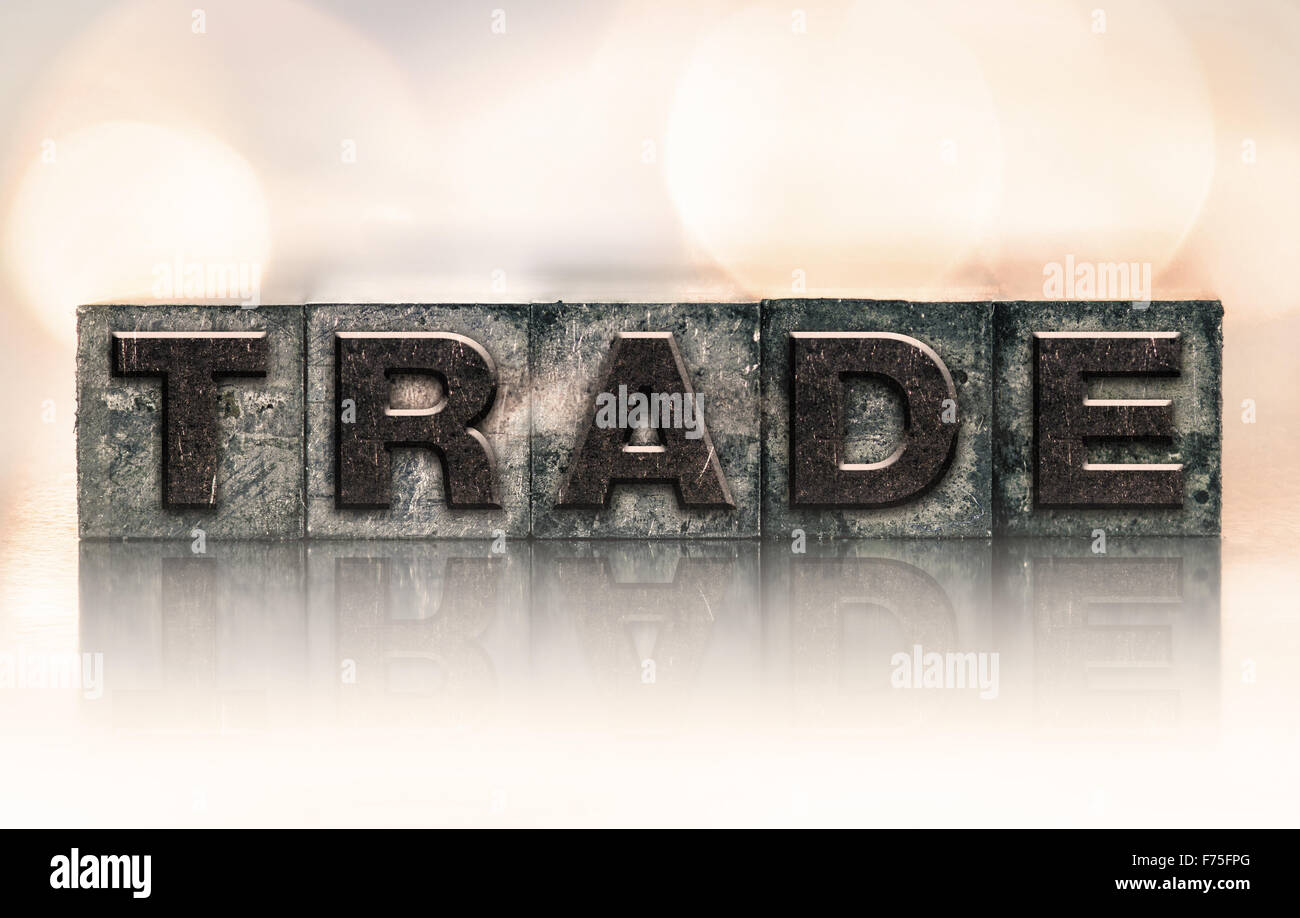 The word "TRADE" written in vintage ink stained letterpress type Stock ...