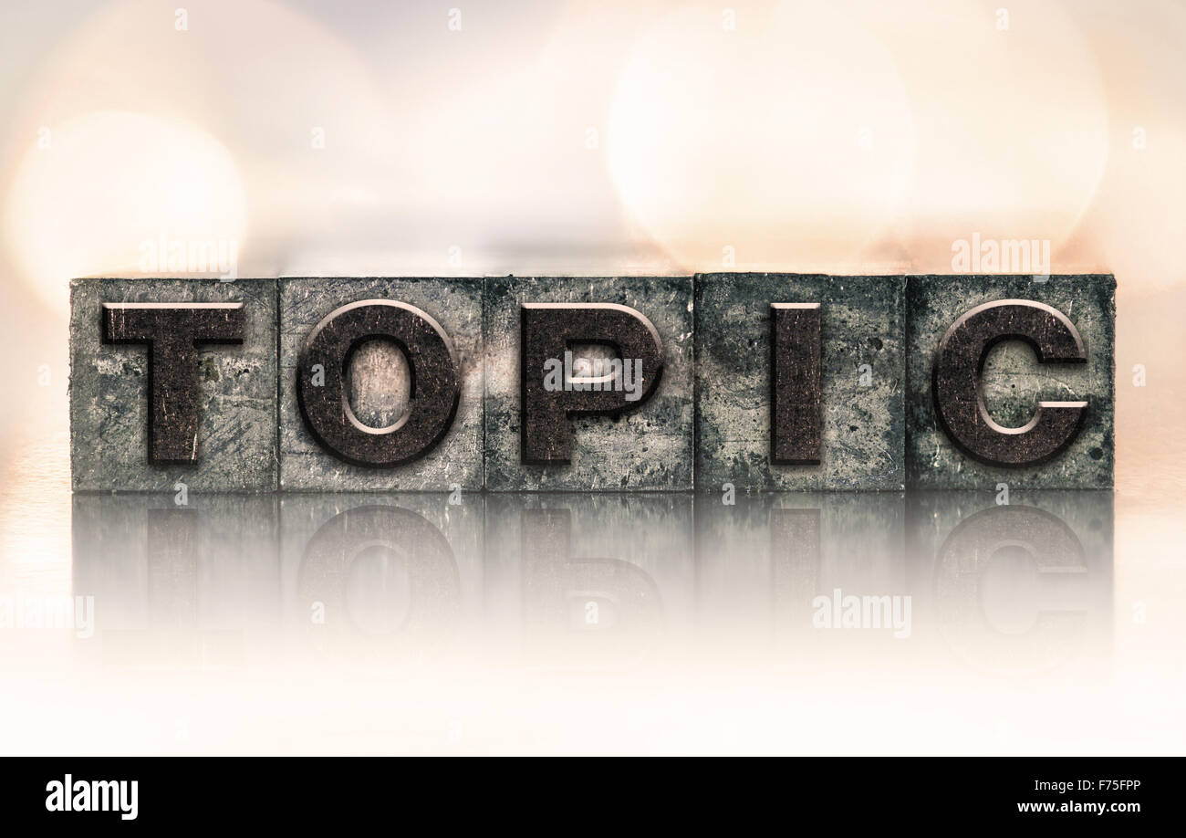 The word "TOPIC" written in vintage ink stained letterpress type Stock ...