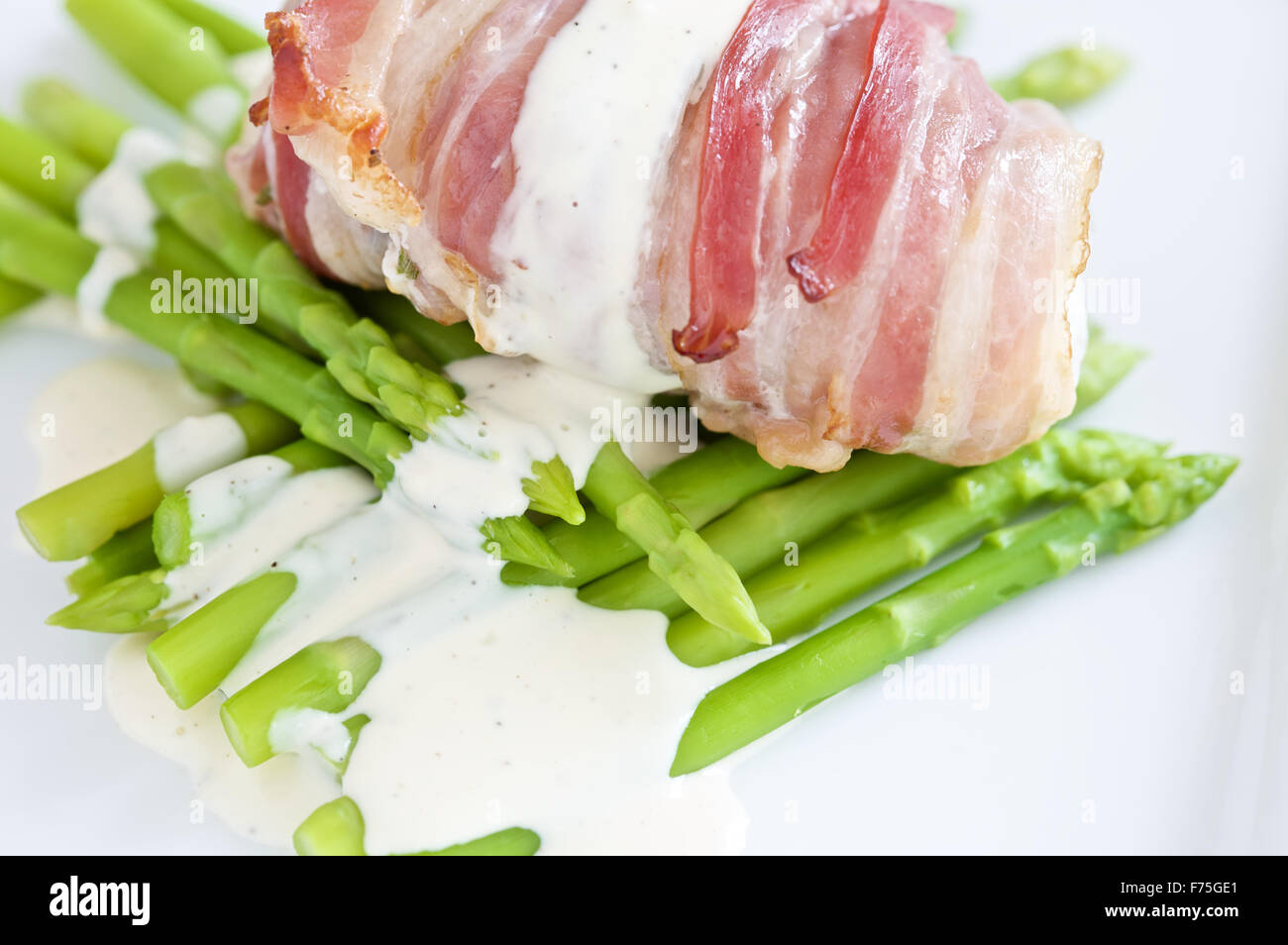 Angler fish wrapped in pancetta Stock Photo - Alamy