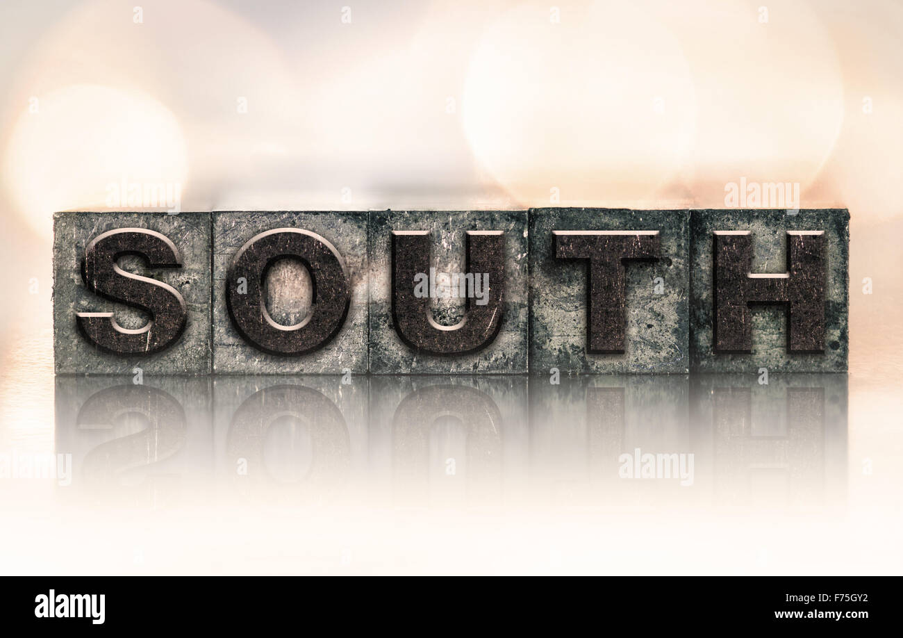 The word "SOUTH" written in vintage ink stained letterpress type Stock ...