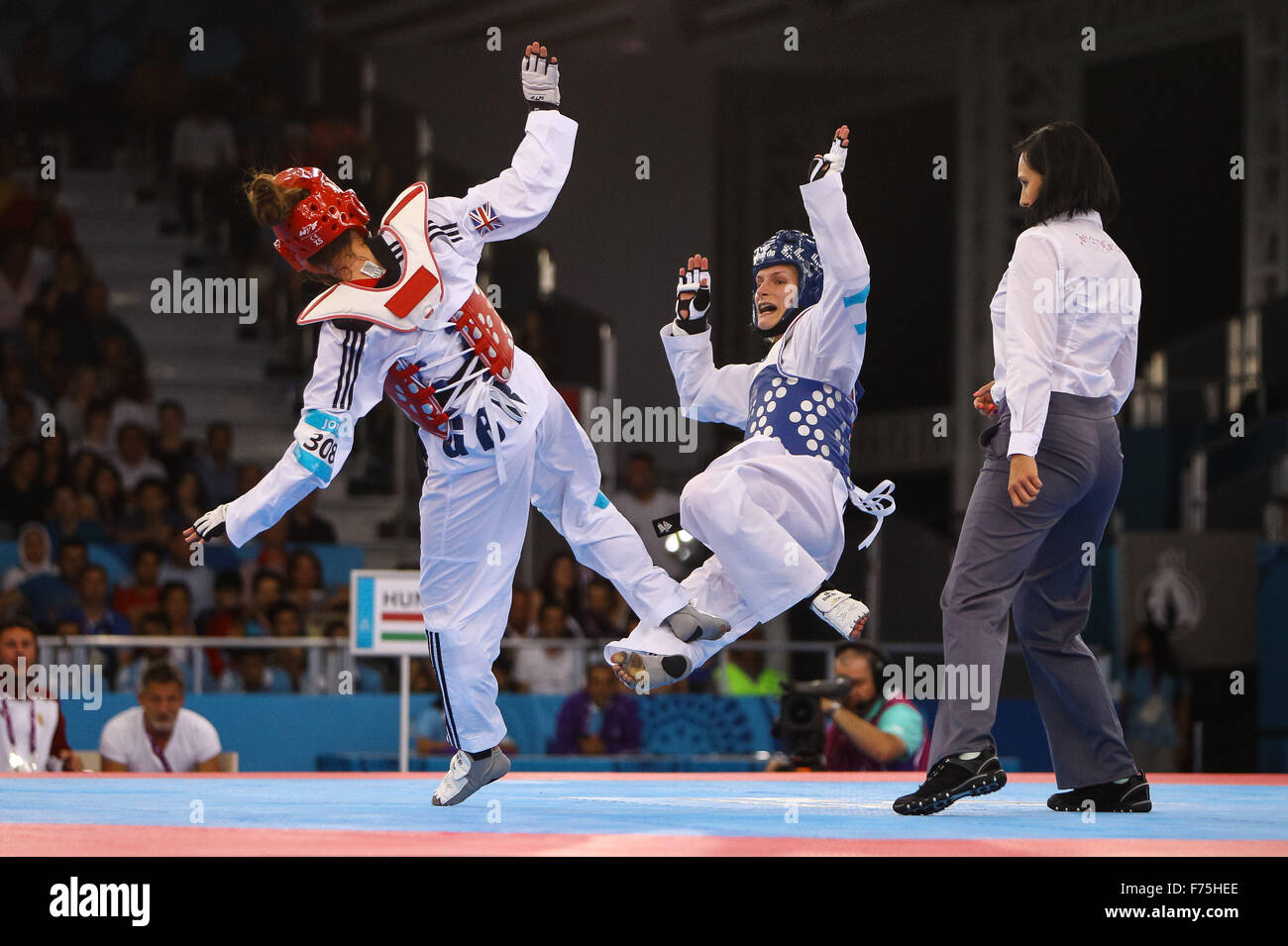 Jade Jones (GBR), left, competes with Edina Kotsis (HUN), right ...