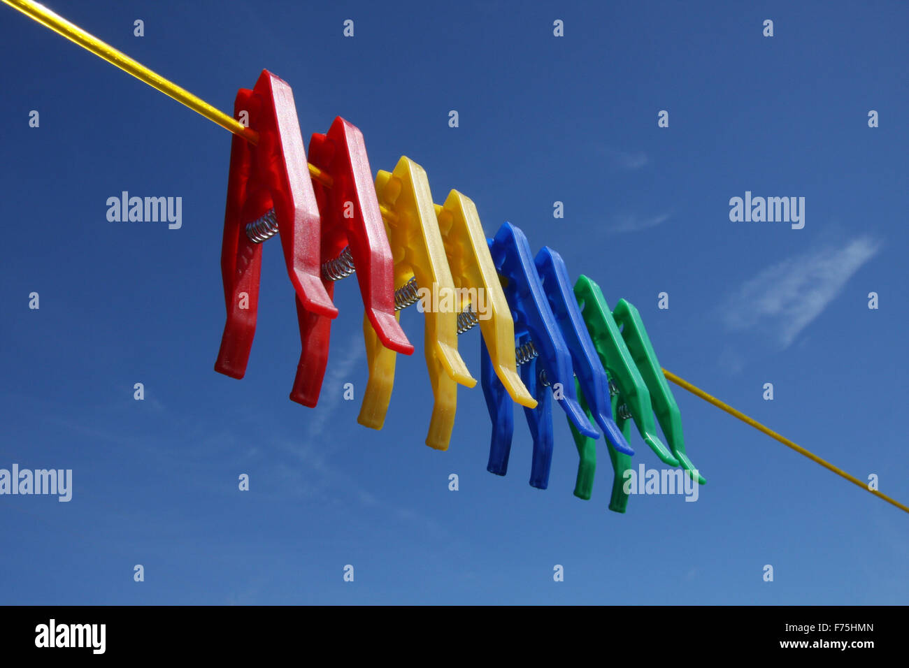 Pegs on washing clothes laundry line Stock Photo - Alamy