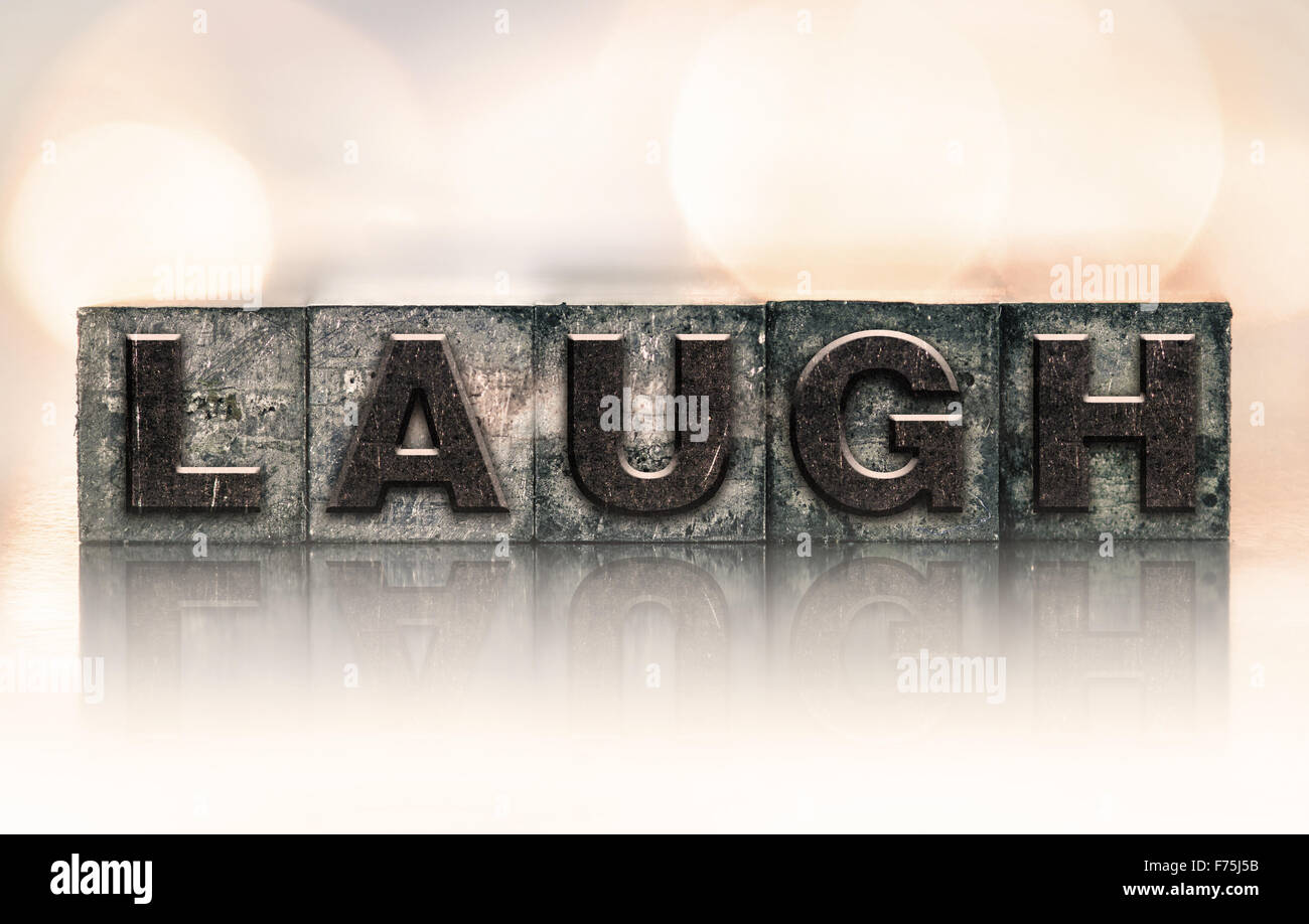 The word "LAUGH" written in vintage ink stained letterpress type Stock ...