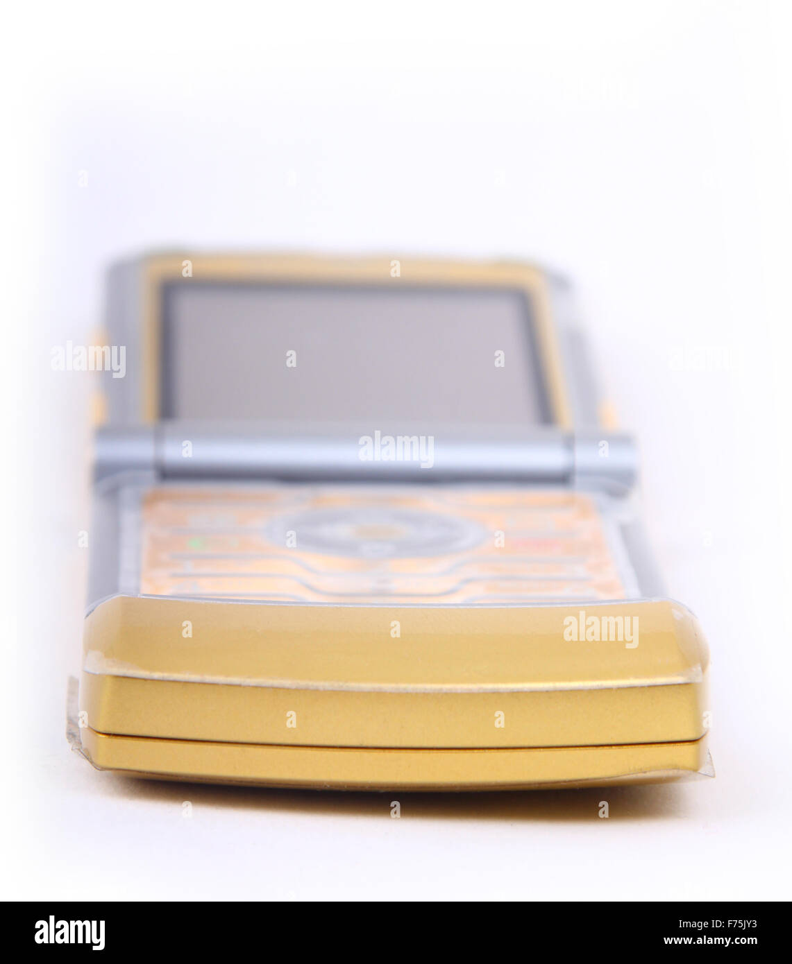 gold mobile phone on a white background Stock Photo - Alamy