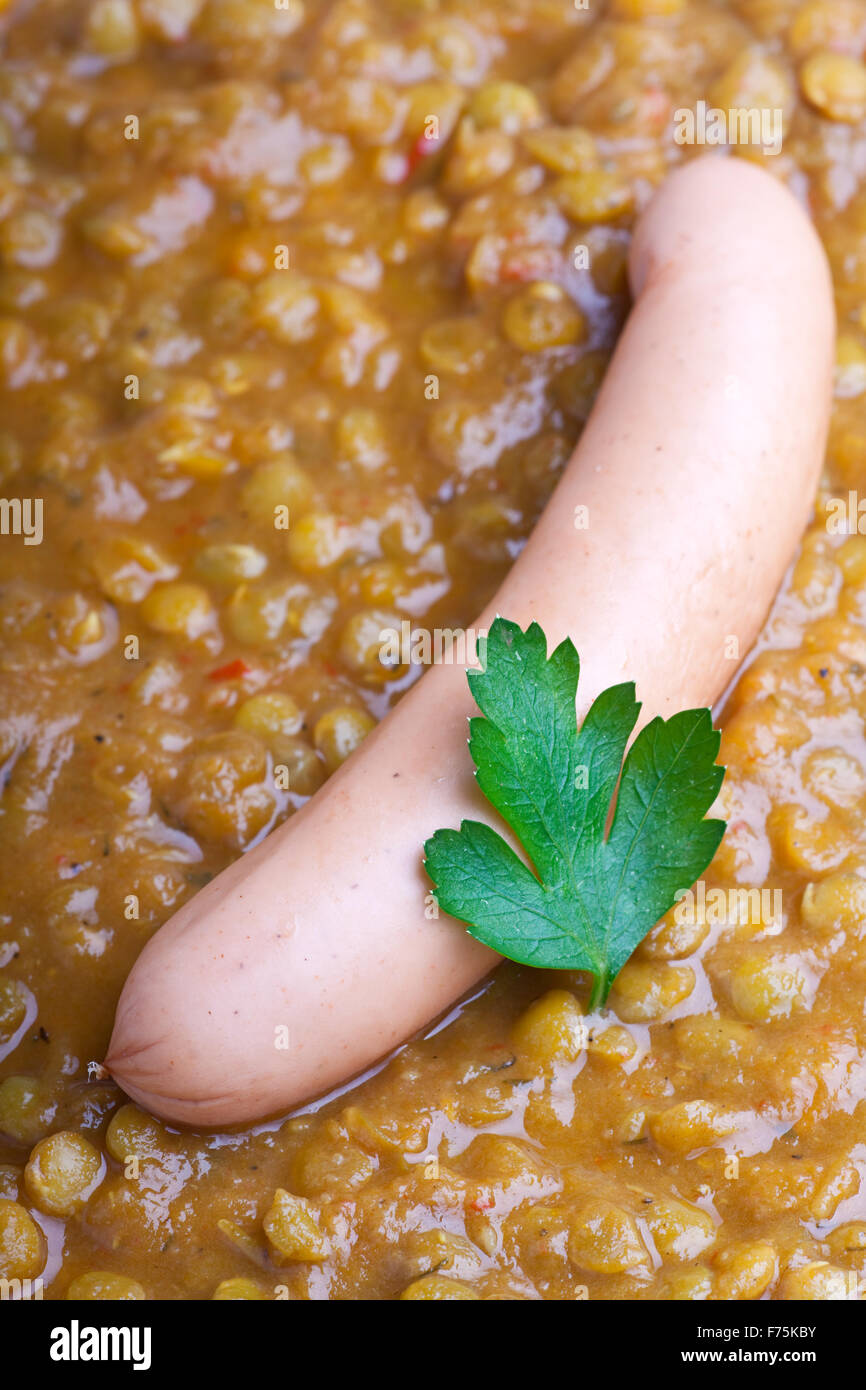 single wiener on a bed on beans Stock Photo - Alamy