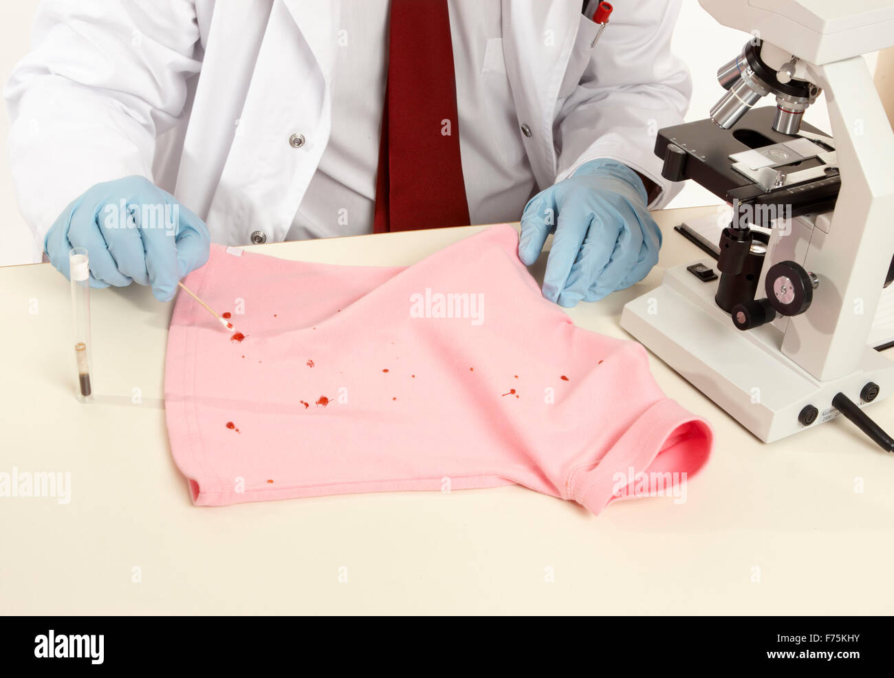 Forensic swabbing a stain Stock Photo - Alamy