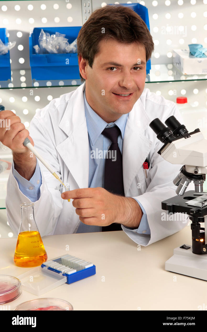 Smiling research scientist or other occupation Stock Photo - Alamy