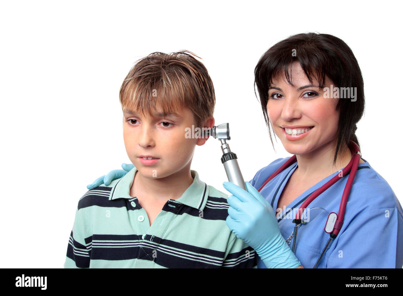 Doctor checking childs ears Stock Photo - Alamy
